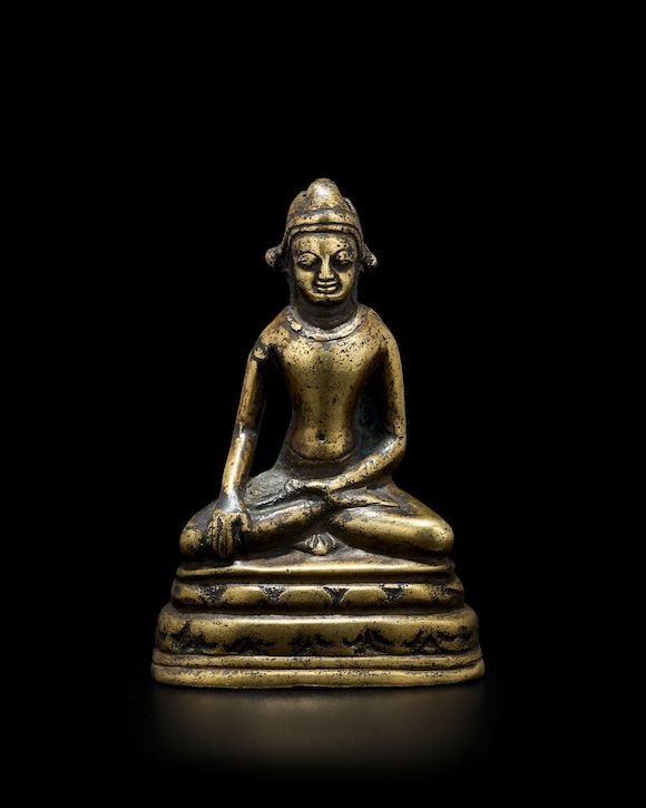 Bonhams : A COPPER ALLOY FIGURE OF CROWNED BUDDHA KURKIHAR, PALA PERIOD ...