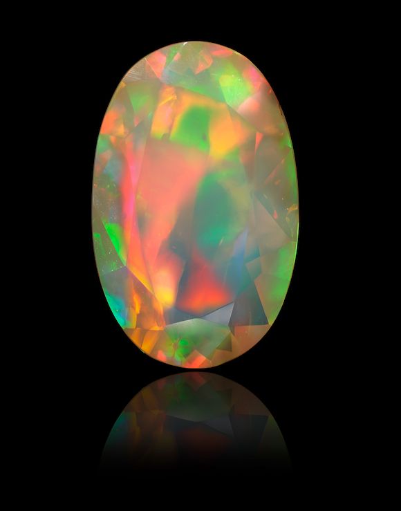 Bonhams : Faceted Crystal Opal with Rolling Flash