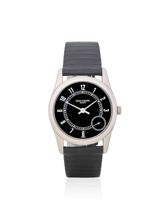 Bonhams : Patek Philippe. A fine 18K white gold automatic black dial ...