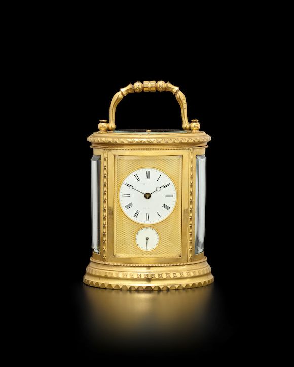 Bonhams : A gilt brass oval bell-striking and repeating carriage clock ...