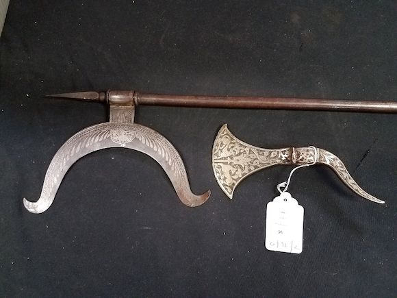Bonhams : An Indian bulova axe and an eastern axe head