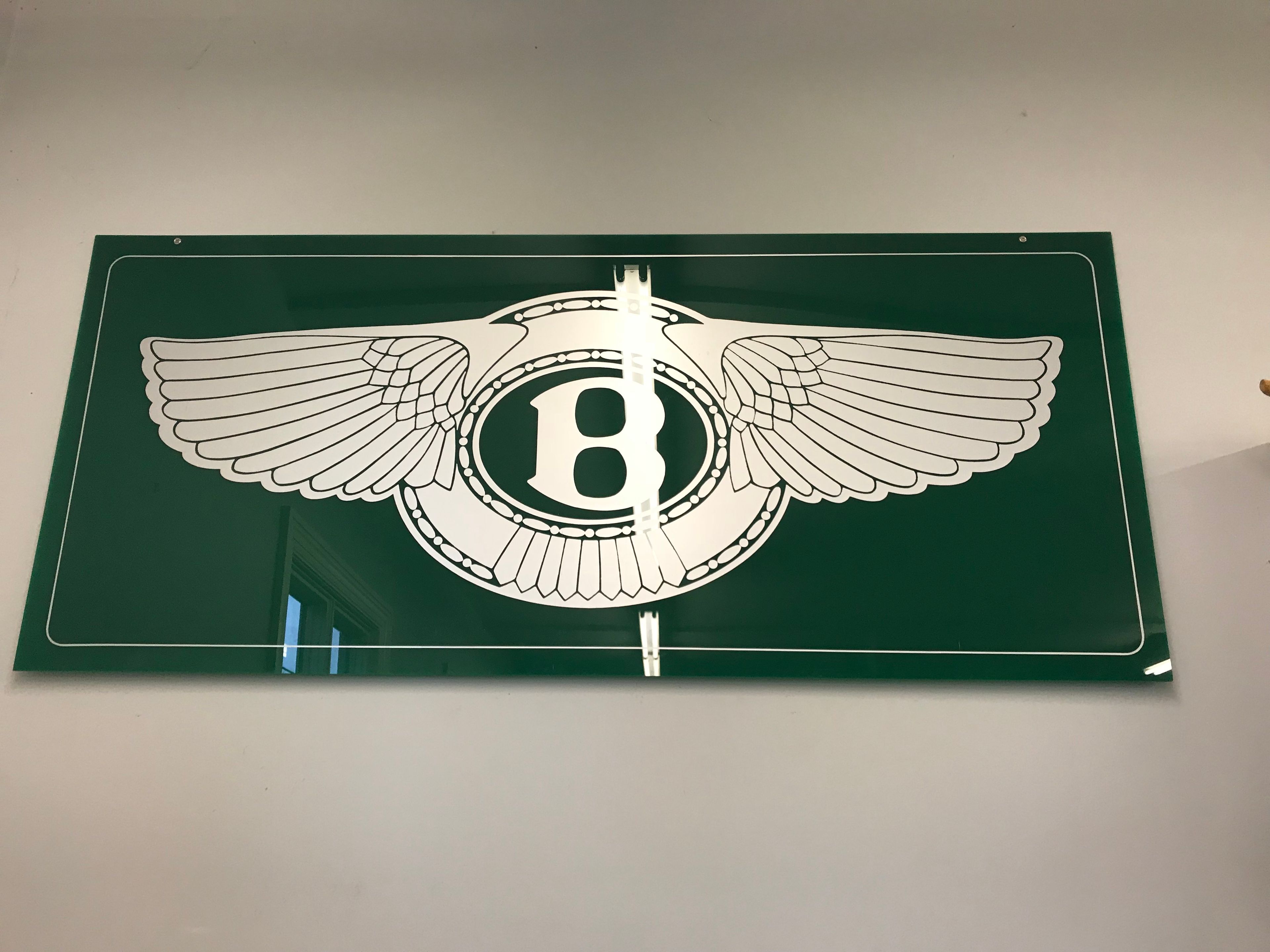 Bonhams Cars : A Large Winged "B" Bentley Garage Sign