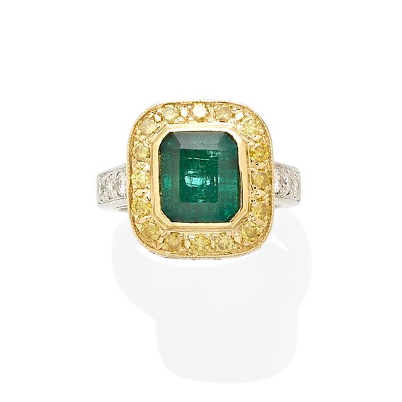 Bonhams : An emerald, colored diamond, diamond and 18k bi-color gold ring