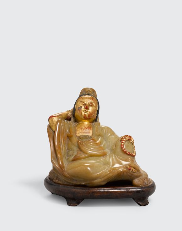 Bonhams : A small polychrome and gilt lacquered soapstone carving of a ...