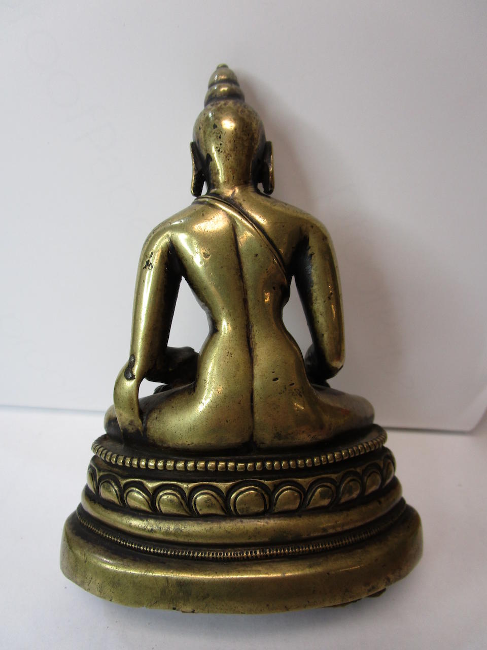 Bonhams A Brass Alloy Figure Of Buddha Northeastern India Or Tibet