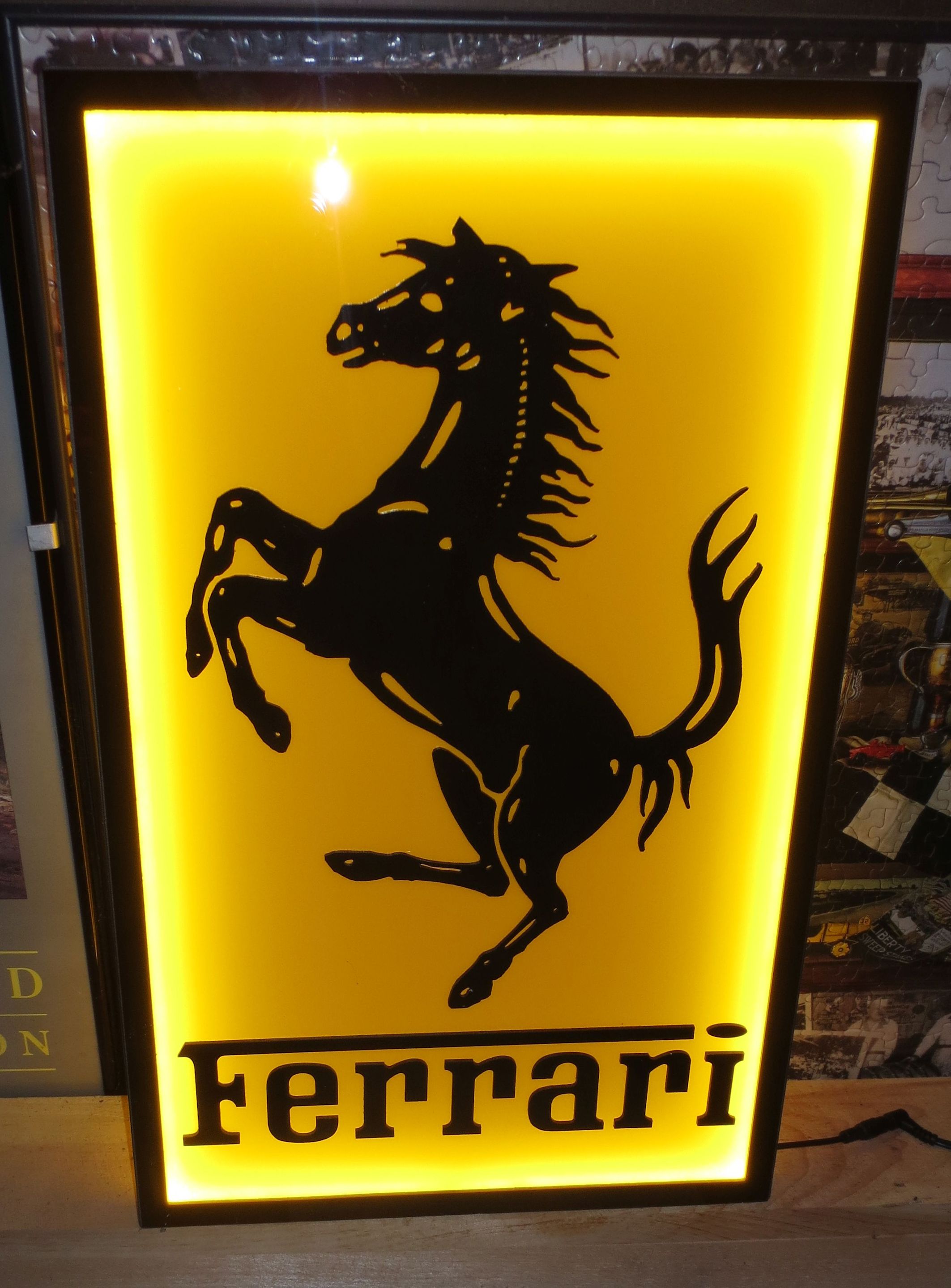 Bonhams Cars : An illuminated Ferrari sign,