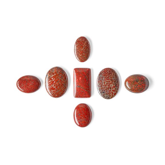 Bonhams : Seven Red Dinosaur Bone Cabochons