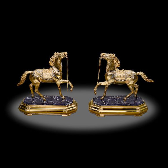 Bonhams : Two silver-gilt horses with sapphire eyes