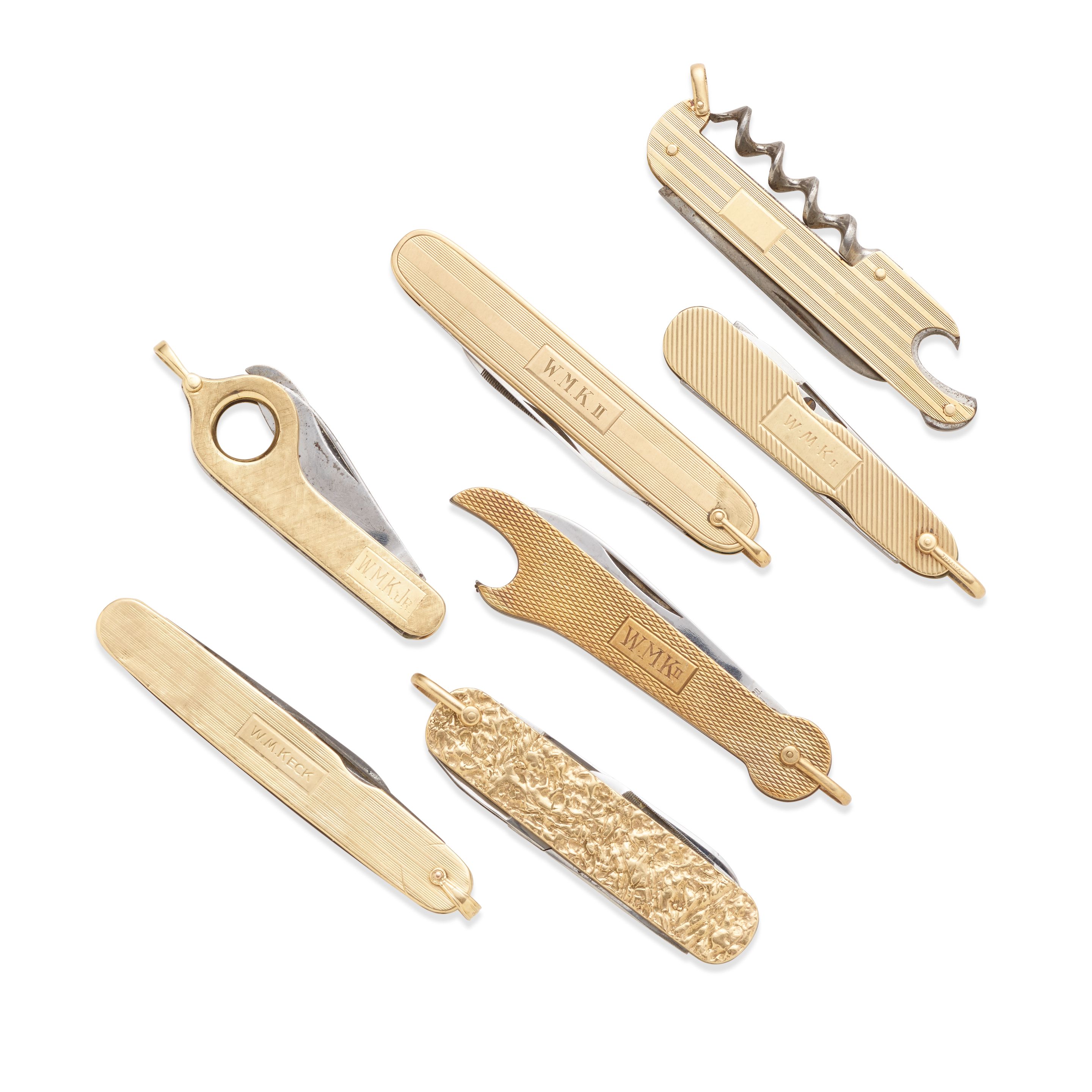 Bonhams : A collection of seven 14k gold pocket knives