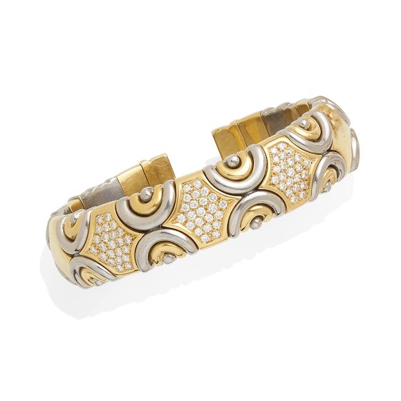 Bonhams : An 18k bi-color gold and diamond bangle, Fred