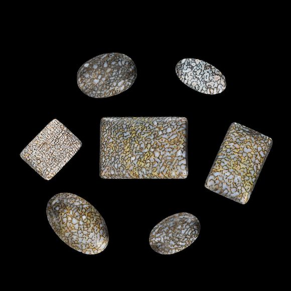 Bonhams : Seven Blue Dinosaur Bone Cabochons