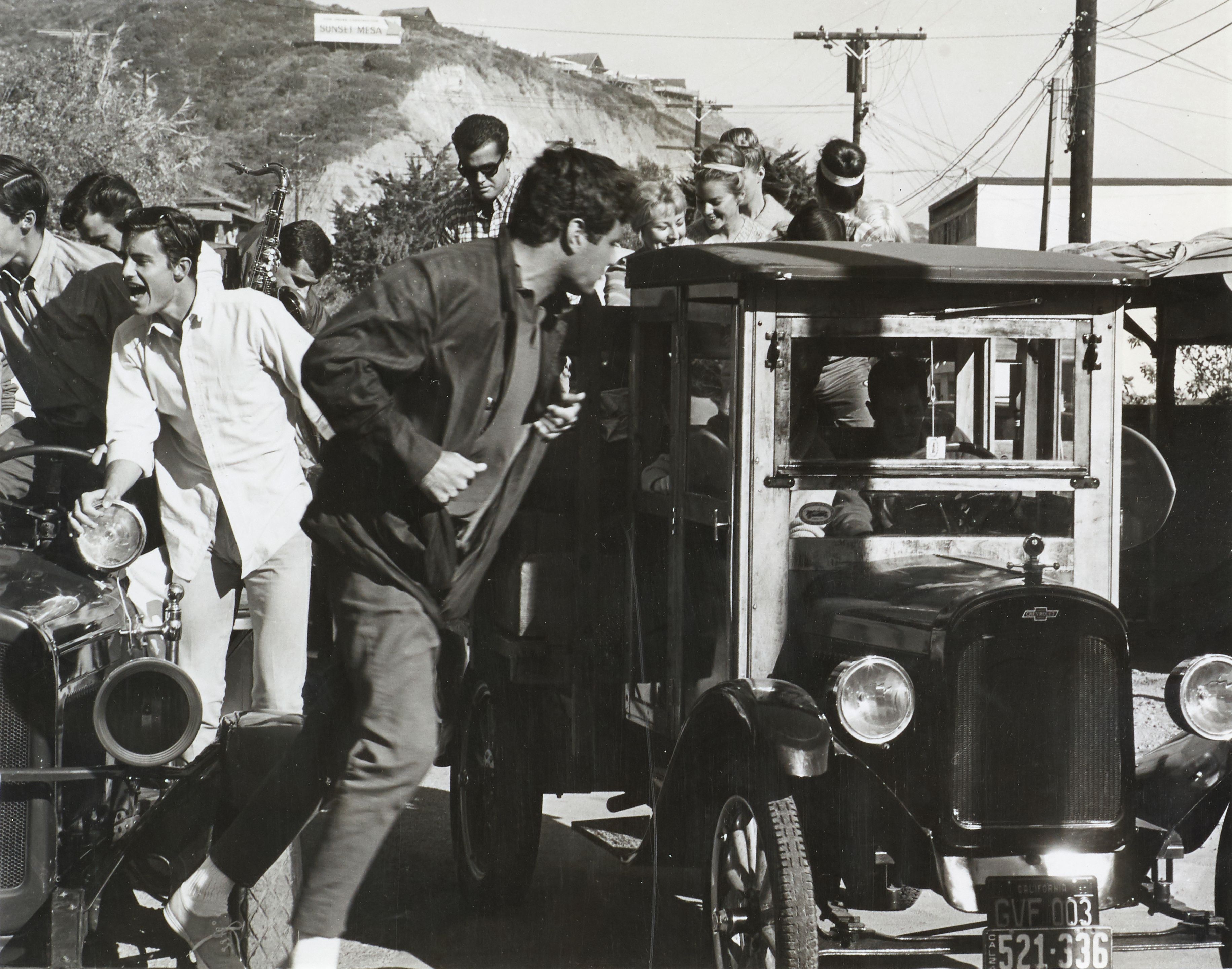 Bonhams : A black and white photograph of Mickey Dora