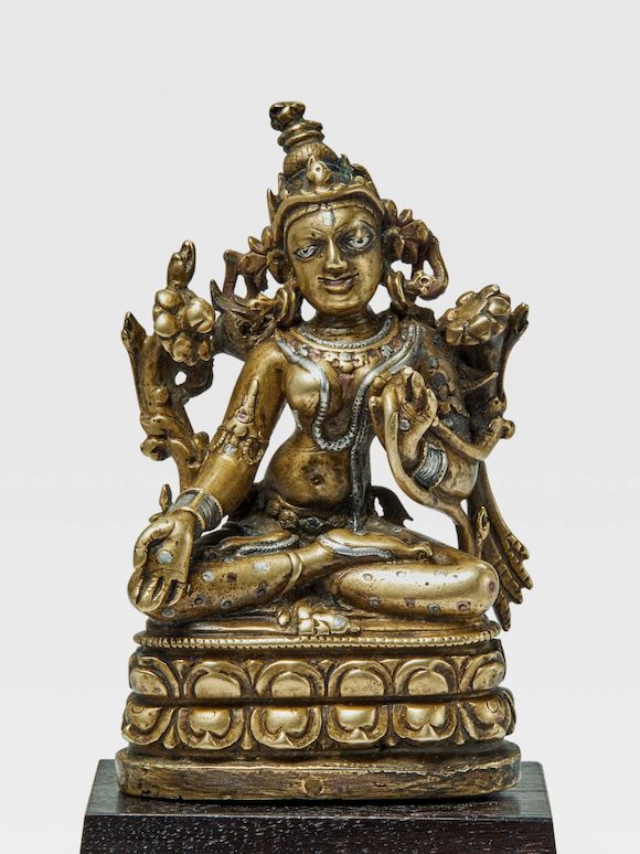 Bonhams : A SILVER AND COPPER INLAID BRASS FIGURE OF SITATARA ...