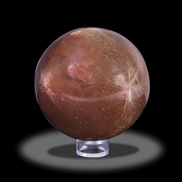 Bonhams : Rutilated Smoky Quartz Sphere with Chatoyant Effect