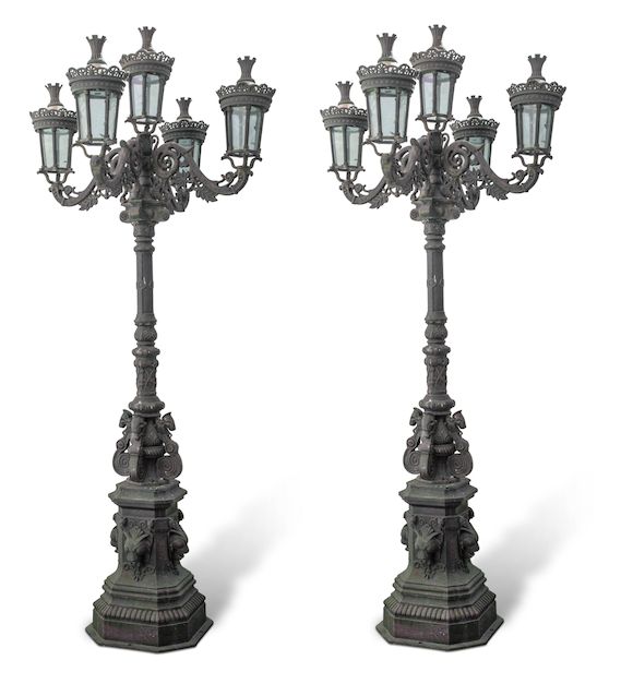 Bonhams : A pair of cast iron street lights on faux marble bases