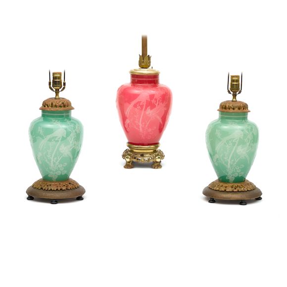 Bonhams : THREE STEUBEN ACID CUT BACK GLASS BIRD VASESEarly 20th century