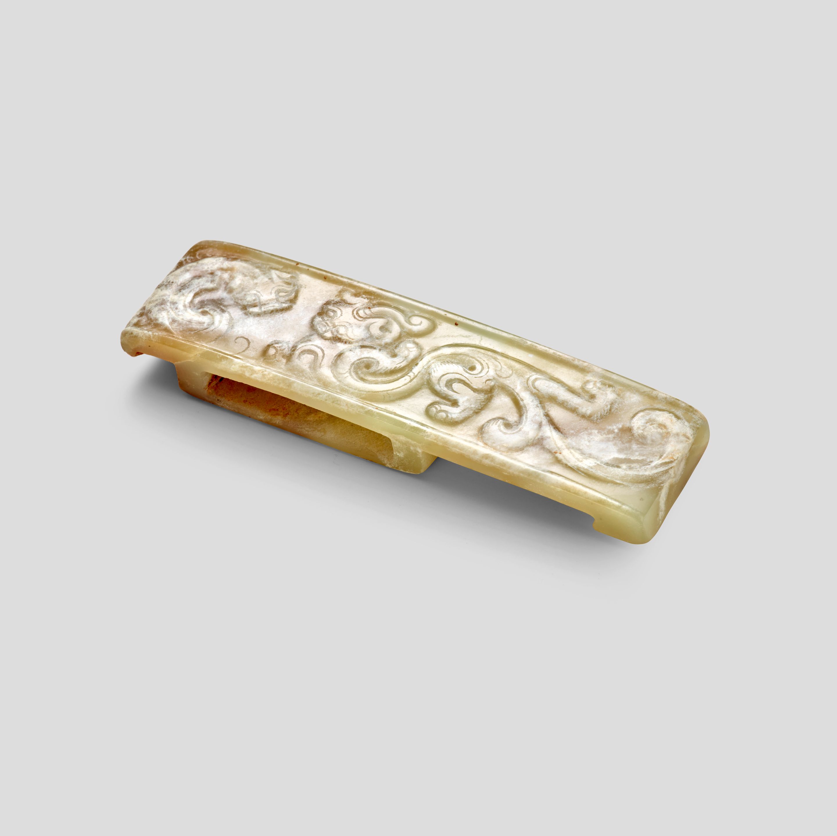 Bonhams : A Fine olive-celadon and calcified Jade scabbard slide Han ...