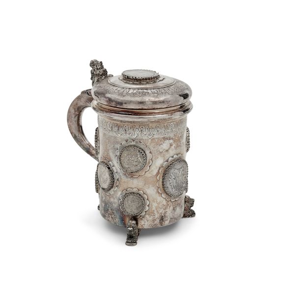 Bonhams : A CONTINENTAL 835 SILVER COIN DECORATED LIDDED TANKARD marked ...