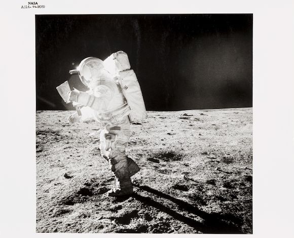 Bonhams : APOLLO 14: NASA PRESS PHOTOGRAPH ED MITCHELL CHECKS HIS MAP ...