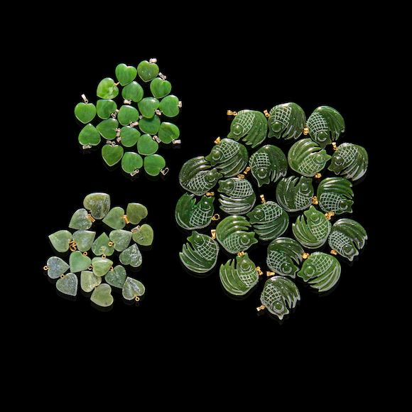 Bonhams : Nephrite Jade Carved Koi and Heart-Shaped Pendants