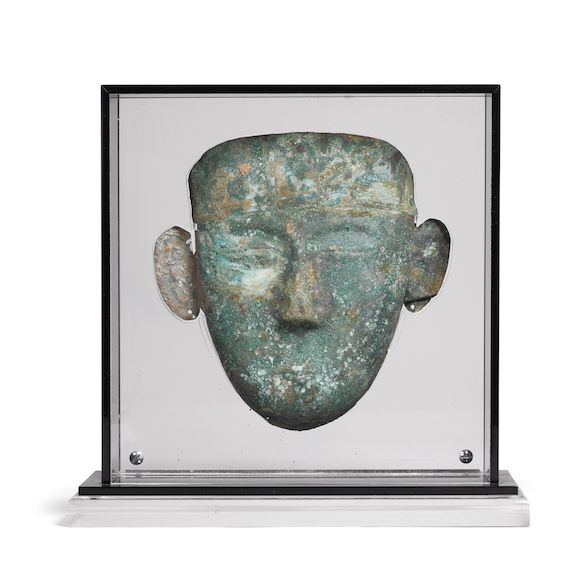 Bonhams : A SILVERED- AND GILT-COPPER-ALLOY FUNERARY MASK Liao dynasty