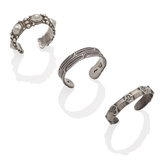 Bonhams : THREE SILVER CUFFS, WILLIAM SPRATLING
