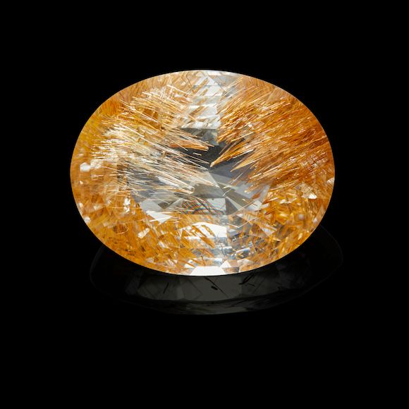 Bonhams : Topaz with Limonite Inclusions--"A MEMBER OF THE 100 CARATS CLUB"