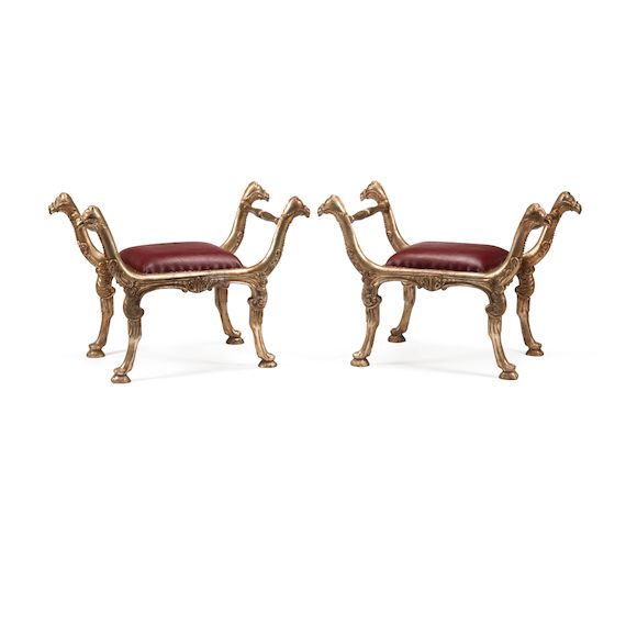 Bonhams : A PAIR OF SILVERED WOOD CAMEL FORM BENCHES