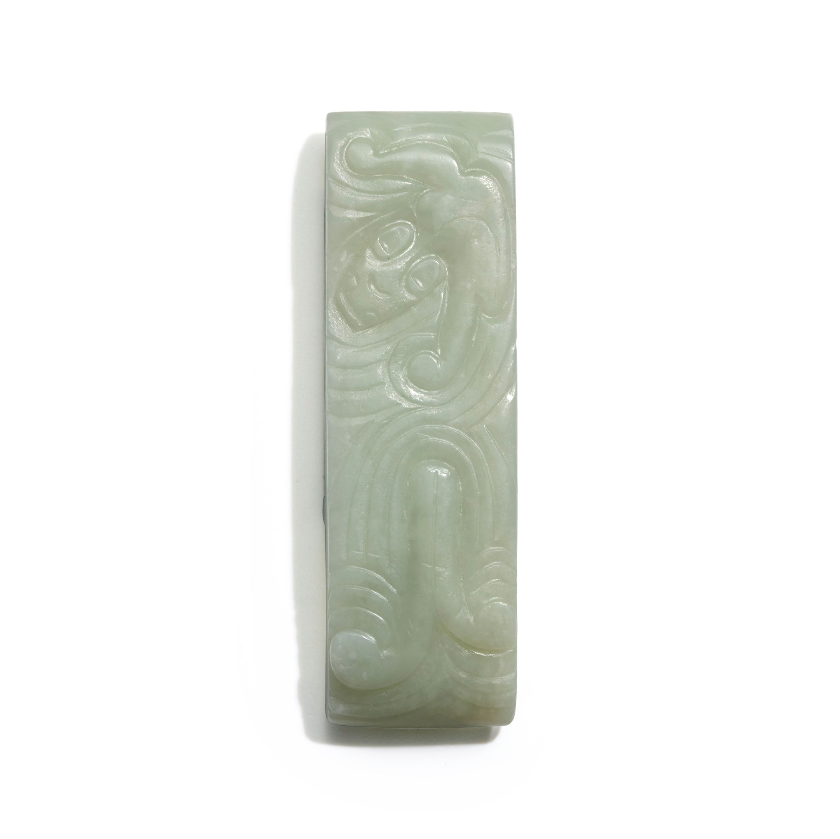 Bonhams : AN ARCHAISTIC PALE CELADON-WHITE JADE SCABBARD SLIDE Qing dynasty
