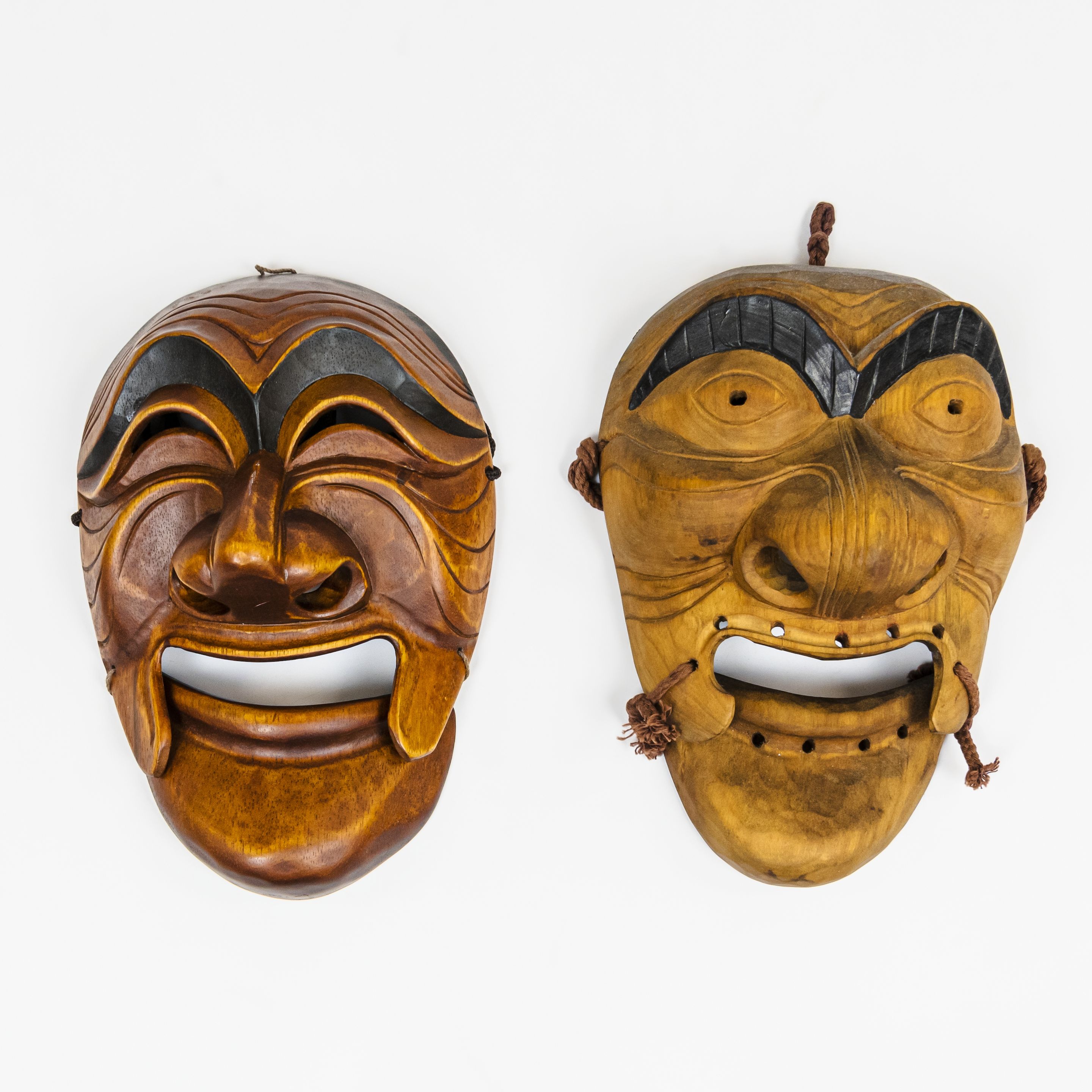 Bonhams Skinner : Two Carved Wood Hahoe Masks