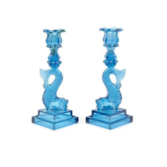 Bonhams : A PAIR OF AMERICAN PRESSED BLUE GLASS DOLPHIN ...