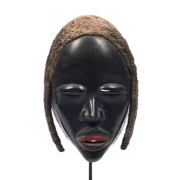 Bonhams Skinner : A Dan wood face mask ht. 9 1/2 in.