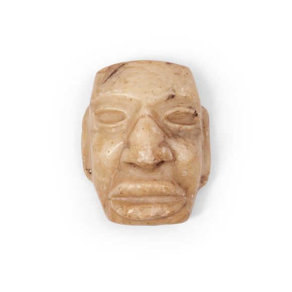 Bonhams Skinner : A Guerrero stone mask ht. 4, wd. 3 1/4 in.