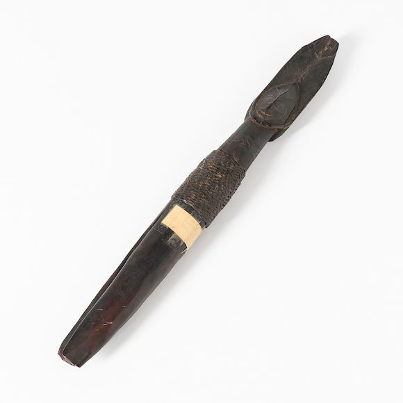 Bonhams Skinner : A New Guinea sago peg 17 1/4 in.