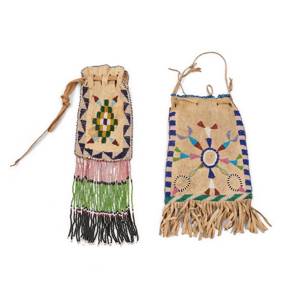 Bonhams Skinner : Two Apache beaded hide bags lg. 9 1/2 and 12 1/4 in.