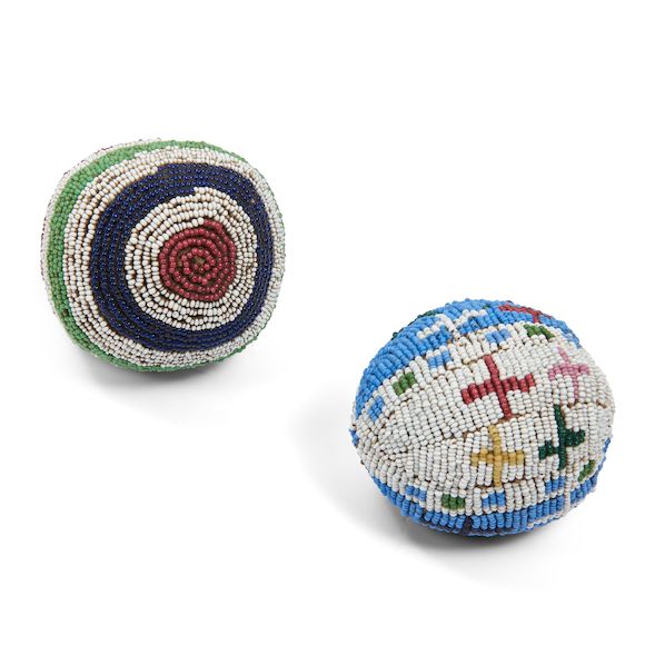 Bonhams Skinner : Two Plains beaded hide balls ht. 2 1/2, wd. 2 7/8 ...