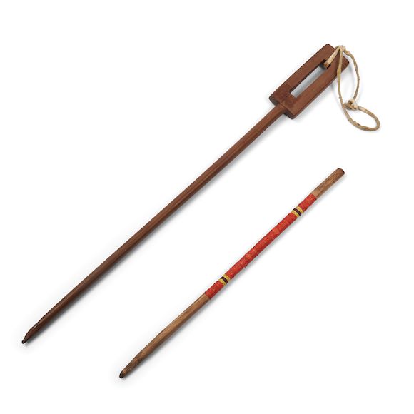 Bonhams Skinner : Two Plains pipe tampers lg. 13 1/4 and 9 1/8 in.