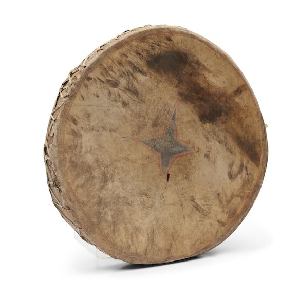 Bonhams Skinner : A Plains hide drum dia. 20, wd. 2 in.