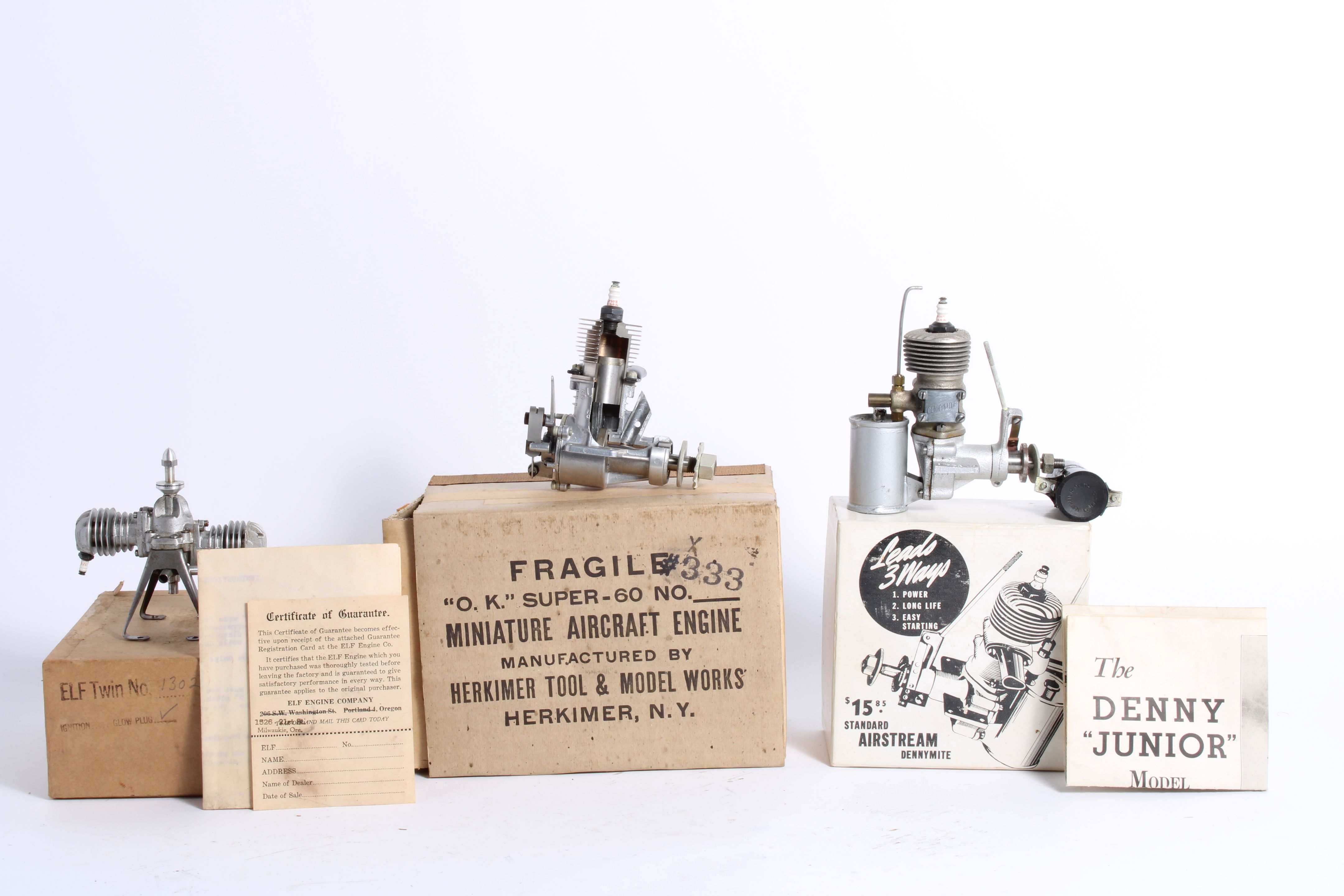 Bonhams Cars : Three gas powered miniature engines in trade boxes, (3)