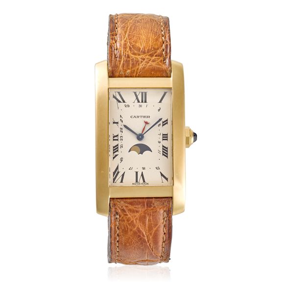 Bonhams : CARTIER. AN 18K GOLD CALENDAR WRISTWATCH WITH MOON PHASE Tank ...