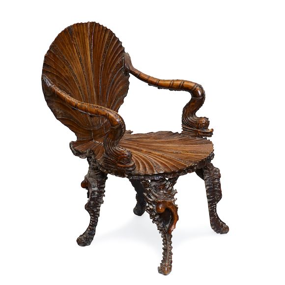Bonhams : AN ITALIAN GROTTO STYLE CARVED WALNUT STAINED CHAIR