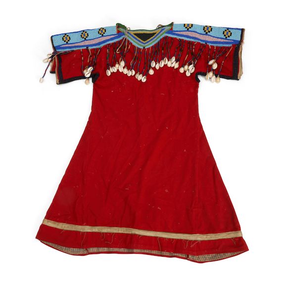 Bonhams Skinner : A Plains beaded cloth dress lg. 36, wd. 30 1/4 in.