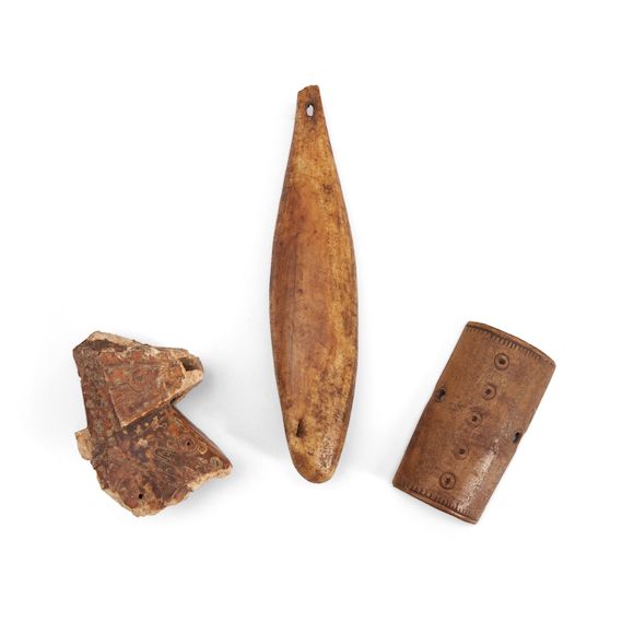 Bonhams Skinner : Three Bering Sea Eskimo items lg. 2 3/8, 2 1/2, and 5 in.