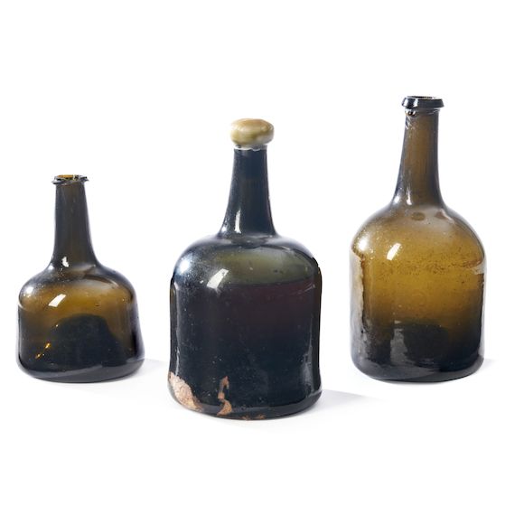 Bonhams Skinner : Three Blown Glass Mallet Bottles, England, early 18th ...