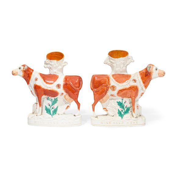Bonhams : A PAIR OF STAFFORDSHIRE LARGE COW FORM SPILL VASES AND A BULL ...
