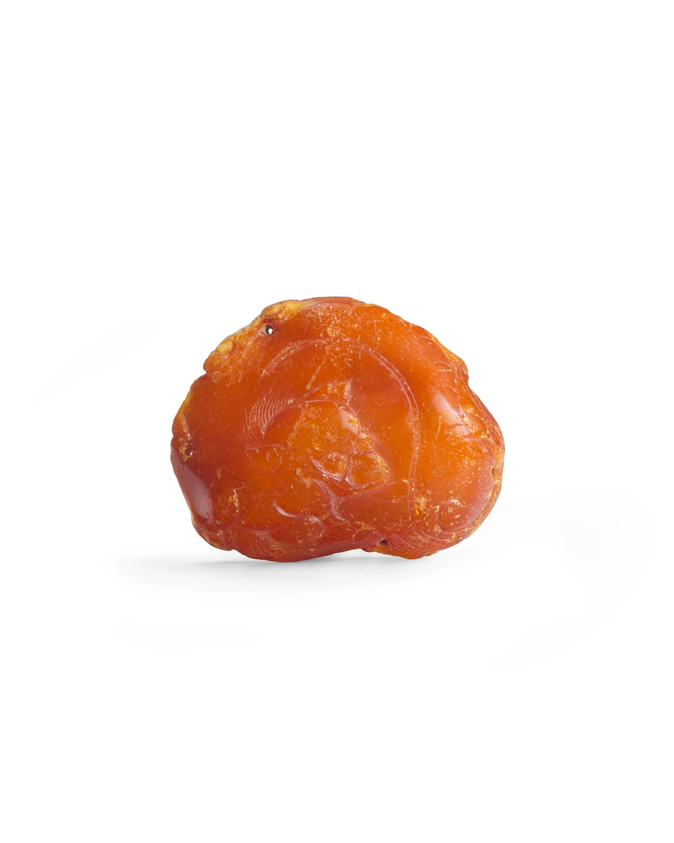 Bonhams : AN AMBER CARVING OF A MYTHICAL BEAST Liao Dynasty