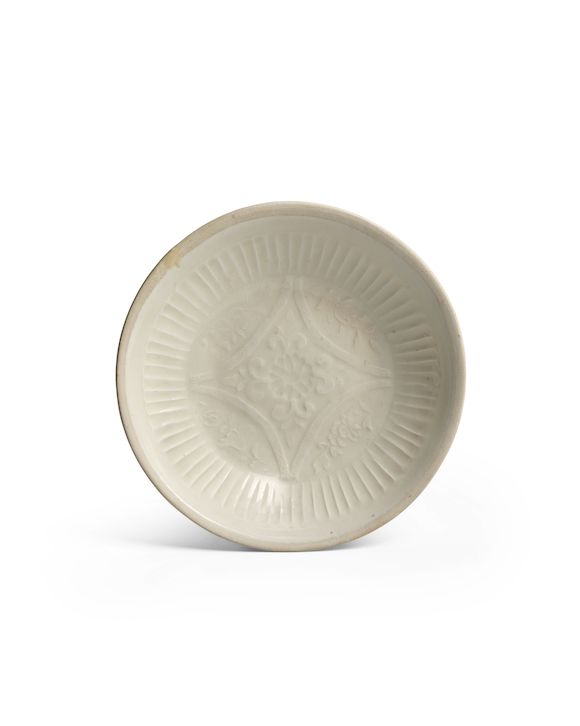 Bonhams : A SMALL WHITE GLAZED MOLDED DISH Liao Dynasty