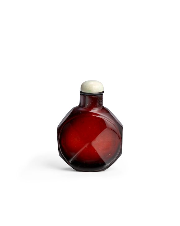 Bonhams : AN OCTAGONAL TRANSPARENT AMBER-RED GLASS BOTTLE 1850-1940