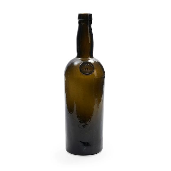Bonhams Skinner : A Sealed 'Cylinder' Wine Bottle, circa 1830-40,