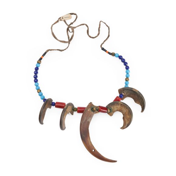 Bonhams Skinner : A Flathead bead and bear claw necklace lg. of largest ...